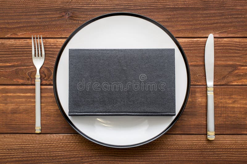 Book on Plate with Knife and Fork. Concept Image of a Book As Main ...