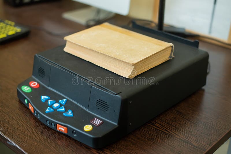A Visually Impaired Man Uses a Scanning and Reading Machine. Stock ...