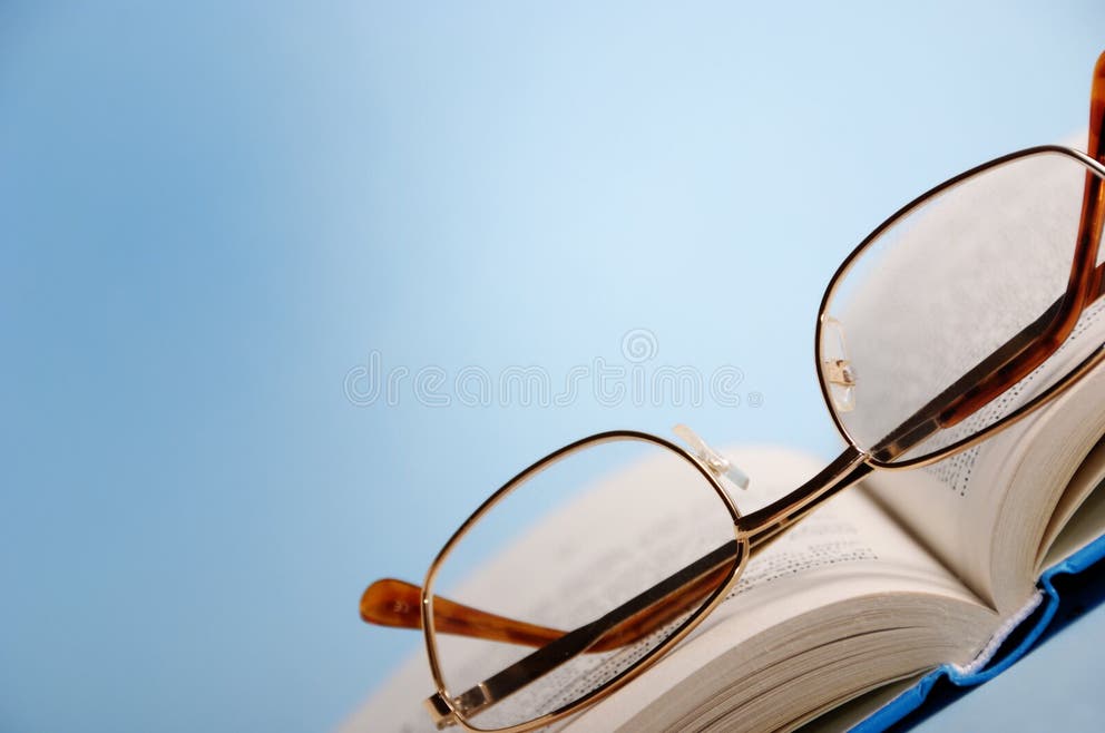 Book with reading glasses stock image. Image of study - 4570211
