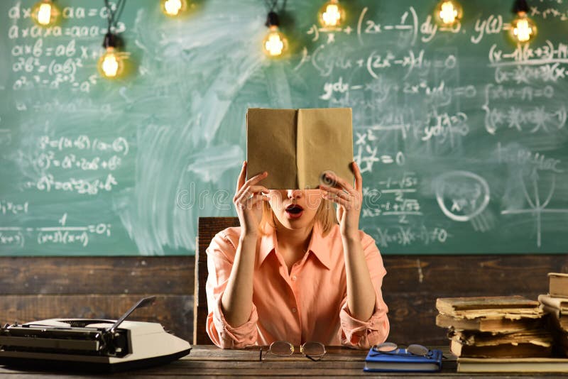 Book Reading. Book in Hand of Woman Teacher in School. Stock Photo ...