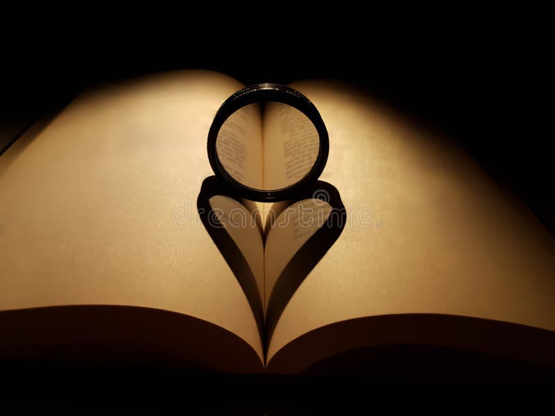 Book with Ring and Heart-shaped Shadow Stock Photo - Image of page ...