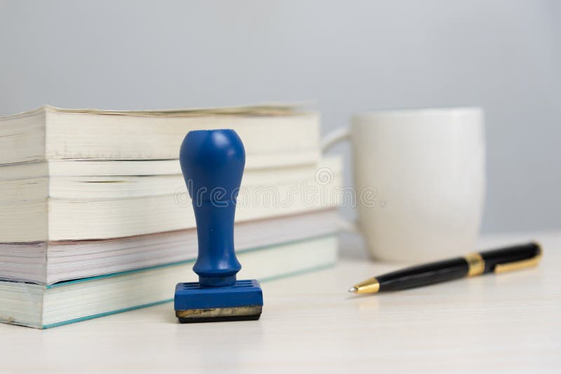 Book and Rubber Stamp and Pen on Desk at Office Business Concept Stock ...