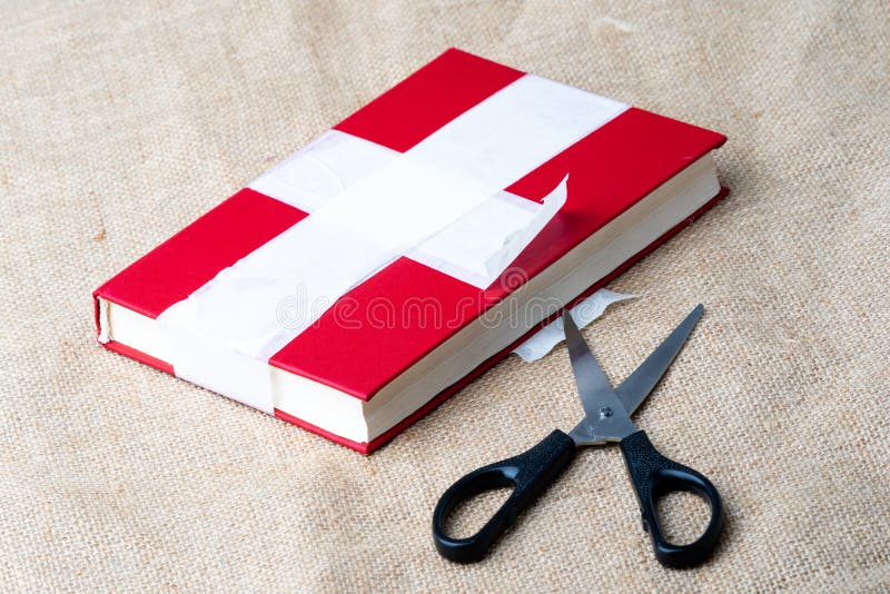 The Book is Sealed with Tape on One Side and Scissors Cut it Off Stock ...