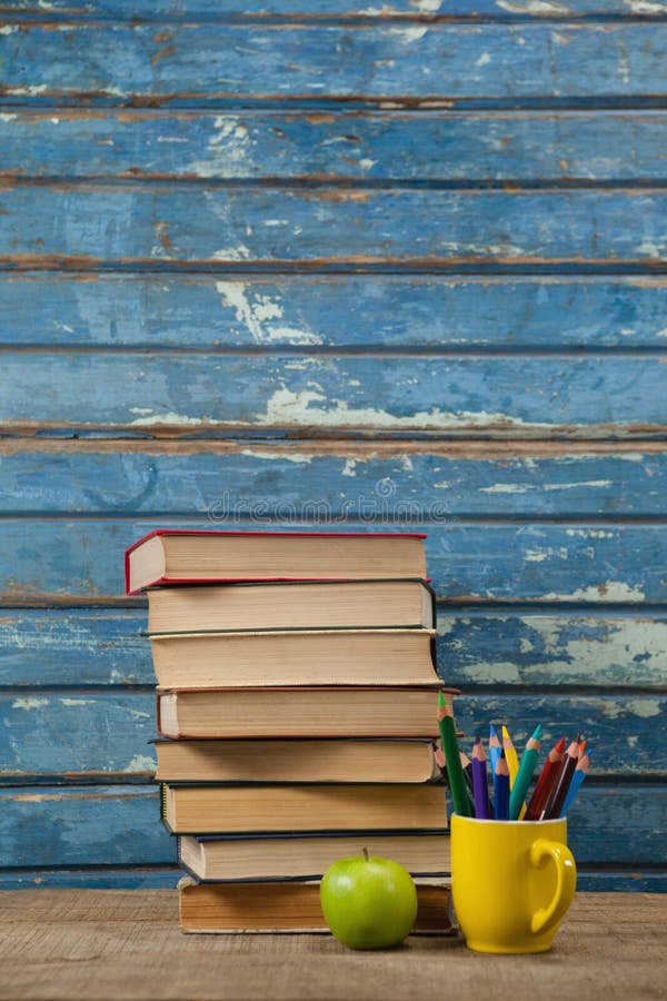 Book Stack, Color Pencils and Apple on Wooden Table Stock Image - Image ...
