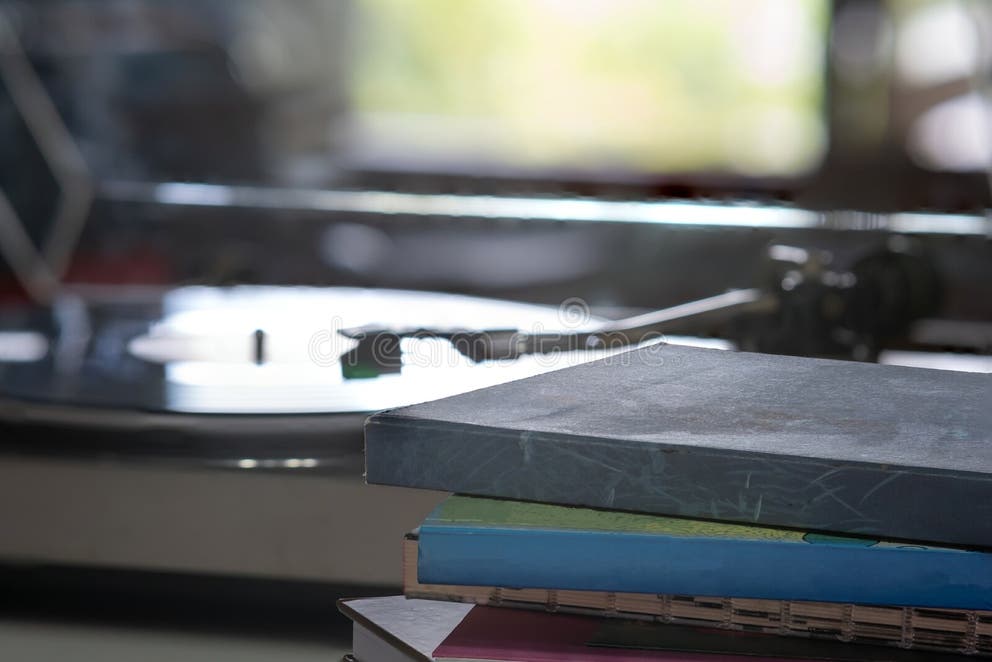 Book Stack on Desk and Blurred Turntable Education Background Relax ...