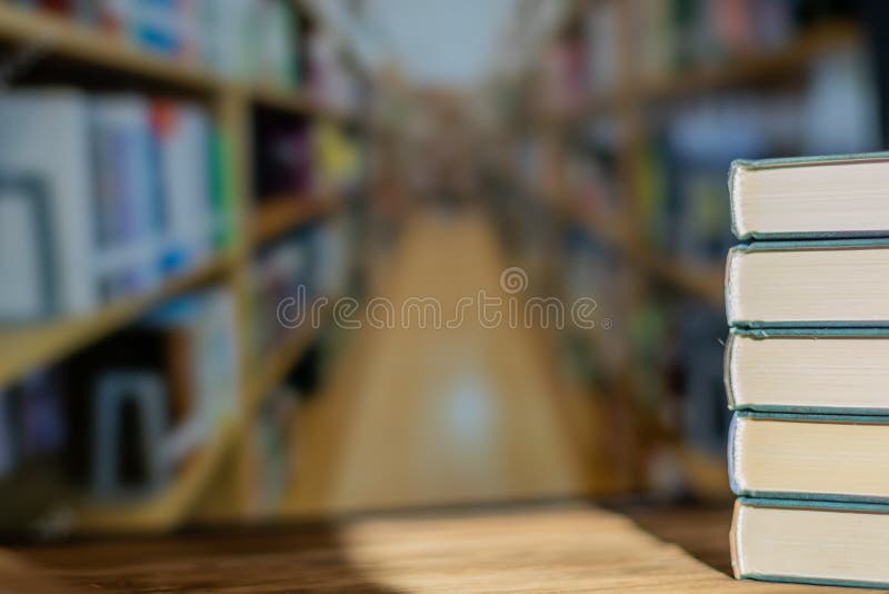 Book Stack on the Desk in the Library Room Under Sunrays Stock Image ...