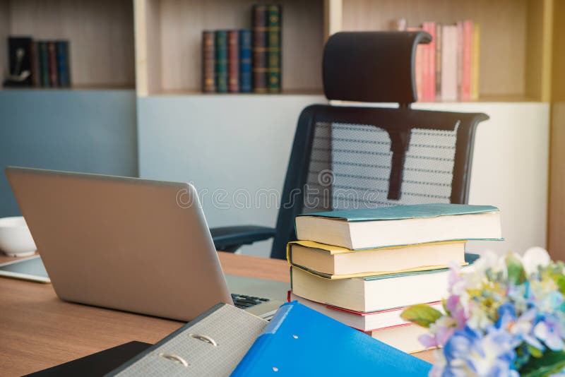 Book Stack and Laptop on Table in Office Stock Image - Image of ...