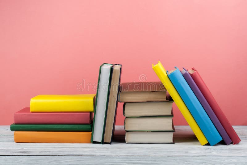 Book Stacking. Open Book, Hardback Books on Wooden Table and Blue ...