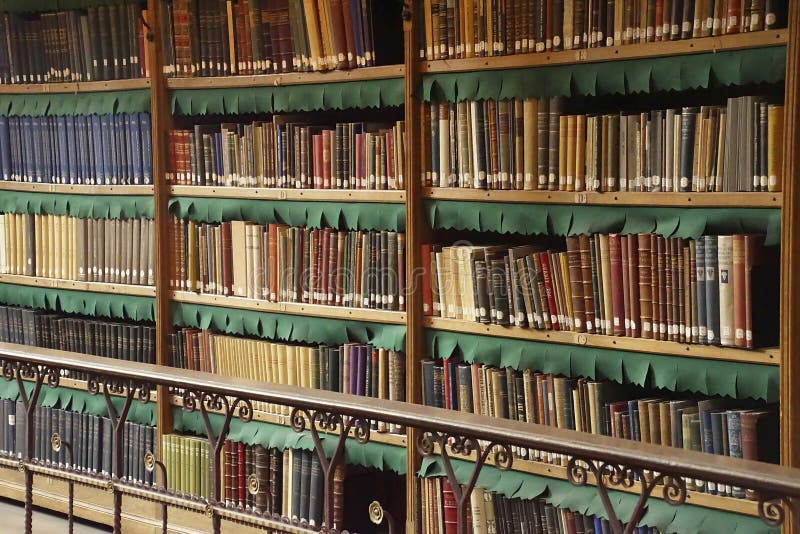 Book stacks in the library editorial photography. Image of stairs ...