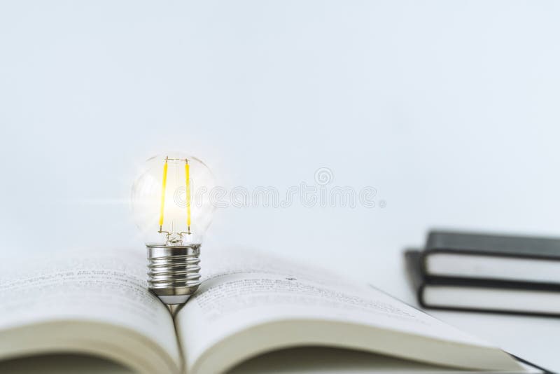Book or Textbook with Bright Lightbulb. Learning or Training Skill ...