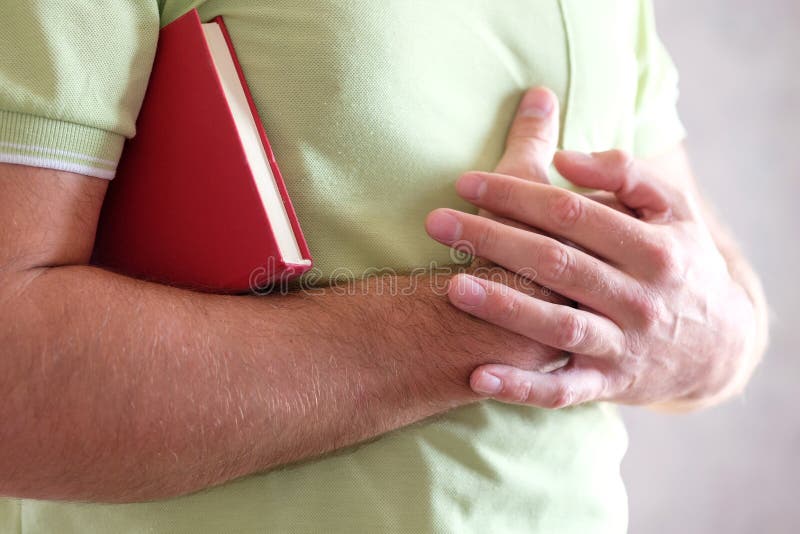 Close-up of the Red Book on it are Scissors and a Piece of Paper with ...