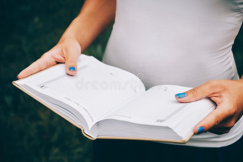 Book on hand stock photo. Image of pencil, notepad, page - 123344496