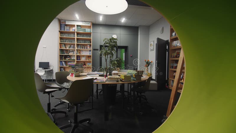 Bookcase with Round Hole and Table in Children Library Stock Video ...