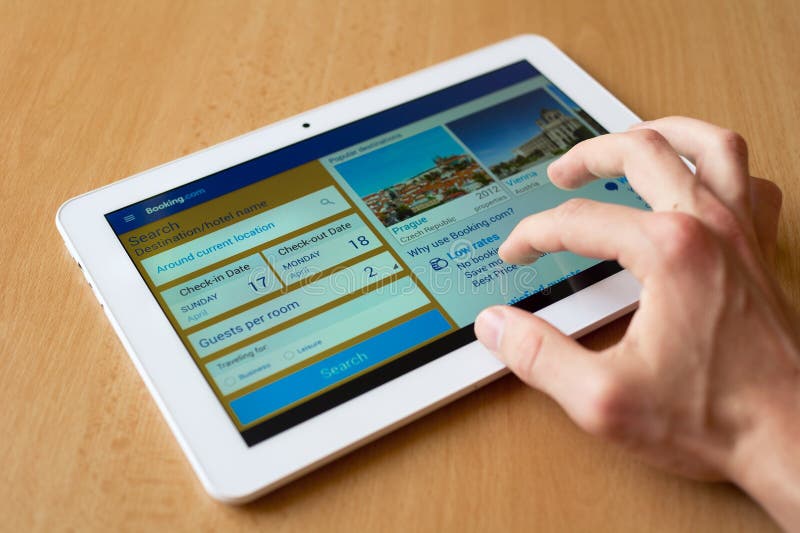 Man in Room Typing Laptop Keyboard with Hotel Booking Screen Stock ...