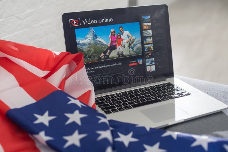 Booking on the Computer. Laptop and American Flag Editorial Stock Image ...