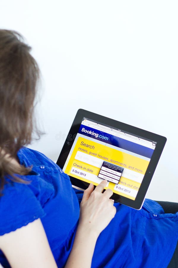 Man in Room Typing Laptop Keyboard with Hotel Booking Screen Stock ...