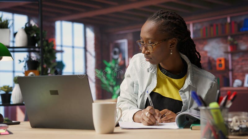 Bookkeeper in Home Office Reading Reports on Laptop, Taking Notes Stock ...