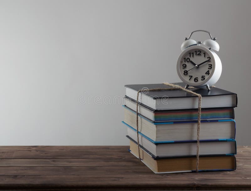Books with alarm clock stock image. Image of praying - 51498379