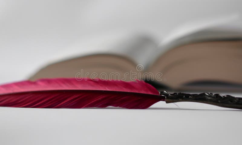 An Open Book of Poems in the Background and a Red Pen Stock Photo ...
