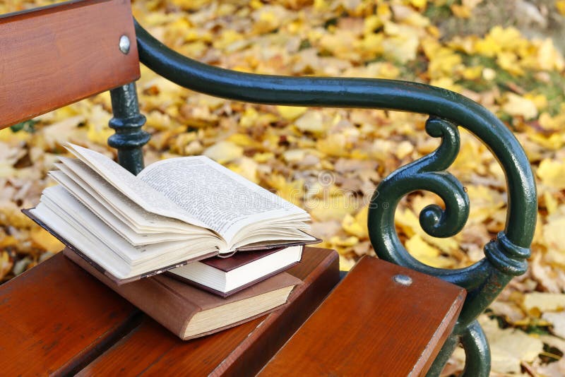 Pile Of Books On Bench In A Park Stock Photo - Image of intellectual ...