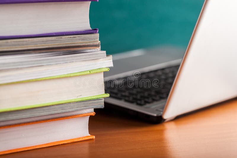 Stack of Books and Magazines with Laptop Stock Image - Image of ...
