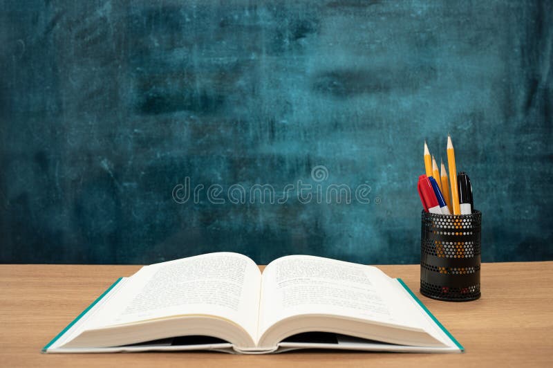 Books on the Desk and a Blank Blackboard. Education Concept Stock Photo ...