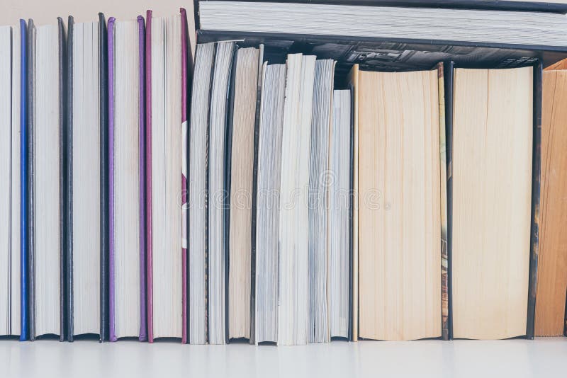 Books of Different Sizes on Bookshelf Stock Photo - Image of stack ...