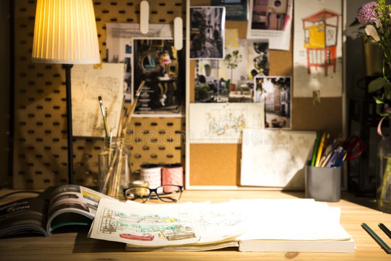 Books and Drafts on Wooden Table Under Lamp Light Stock Photo - Image ...