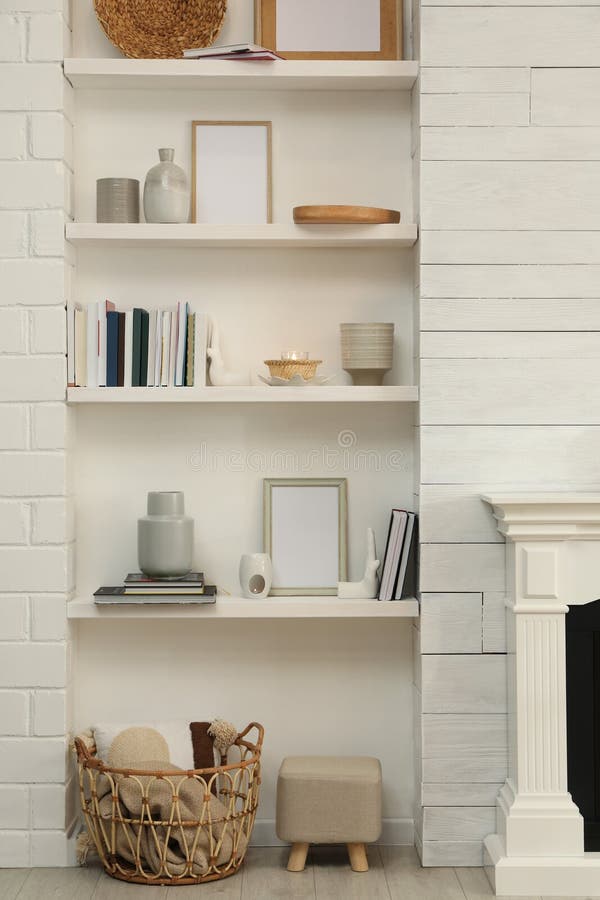 Books, Empty Frames and Different Decor on Shelves Indoors. Interior ...