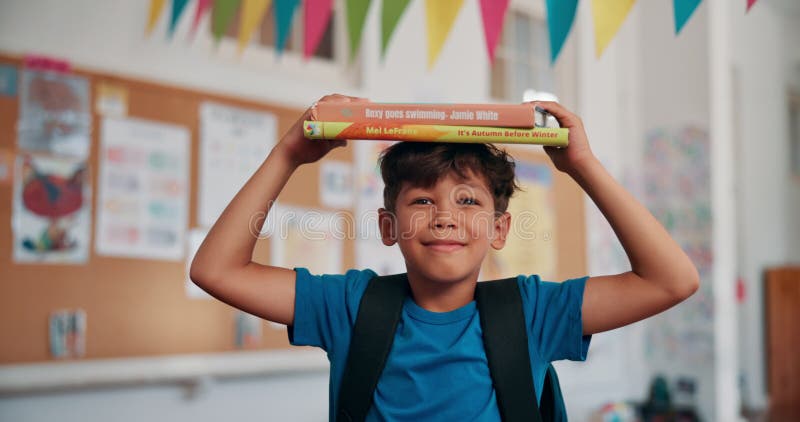 Books, Face and Learning with Boy Student in School Classroom for ...