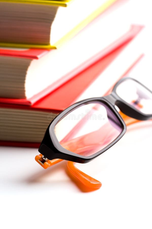 Glasses on a Stack of Books Stock Photo - Image of eyeglasses, books ...