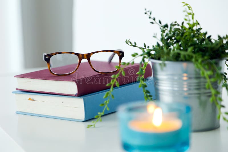 Books, Glasses and Candle on the Night Table. Stock Image - Image of ...