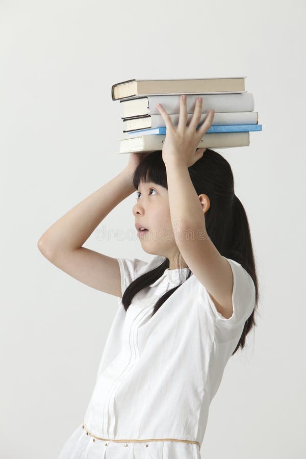Books on her head stock photo. Image of person, learn - 48523082