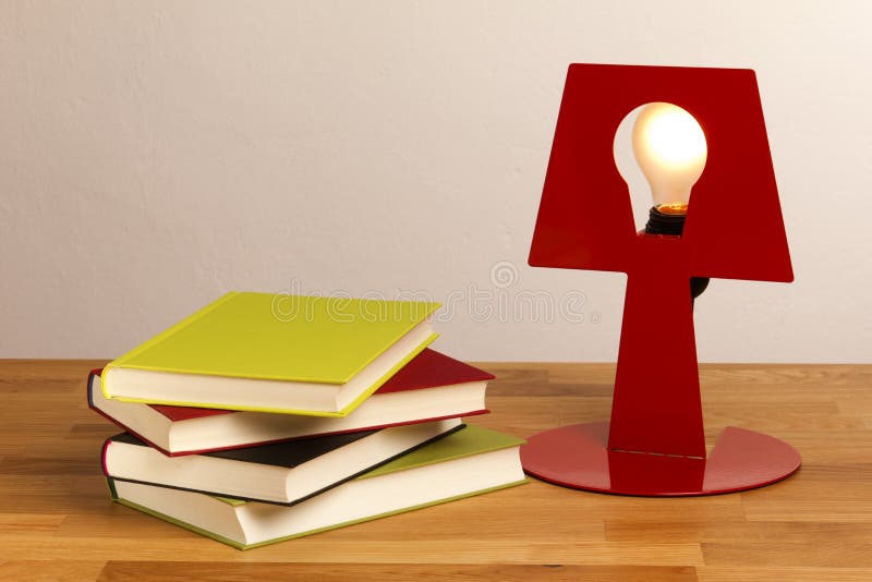 Books with a lamp stock photo. Image of home, bulb, shine - 23290210