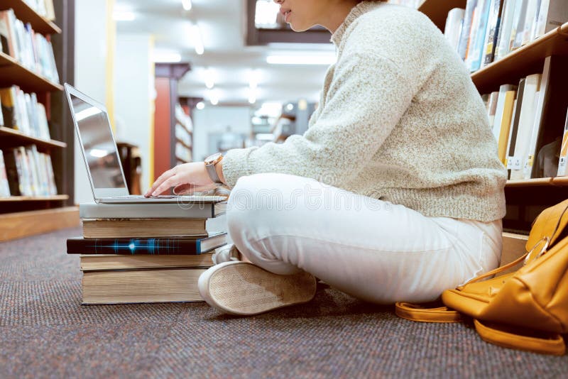Books, Laptop or Student Typing on Library Floor for Research ...