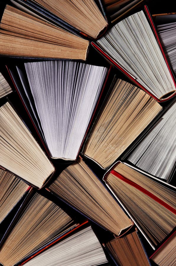 Books. Lots of Colourful Thick Open Books Stand on a Dark Background ...