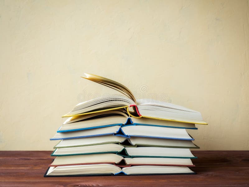 Books lying on the table stock photo. Image of present - 69704322