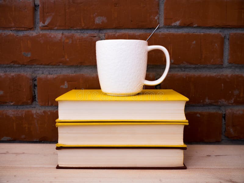 Books lying on the table stock image. Image of beverage - 77536119