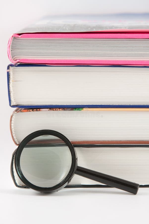 Books and magnifying lens stock image. Image of glass - 19143569
