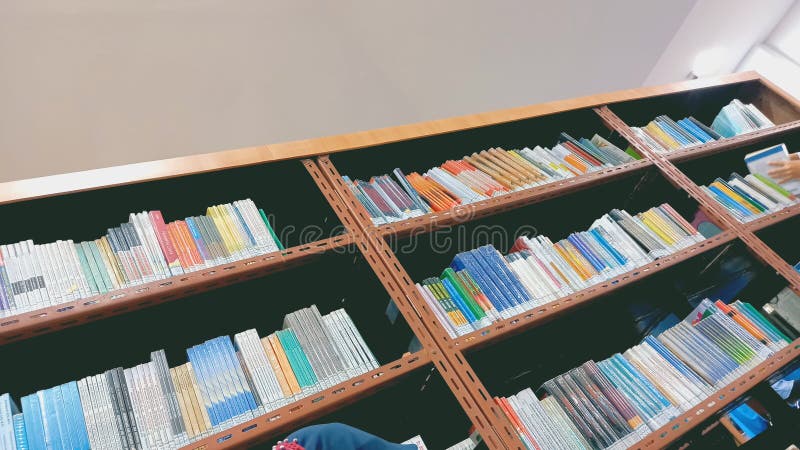 Books Neatly Arranged on Iron Shelves in the Library Room Editorial ...