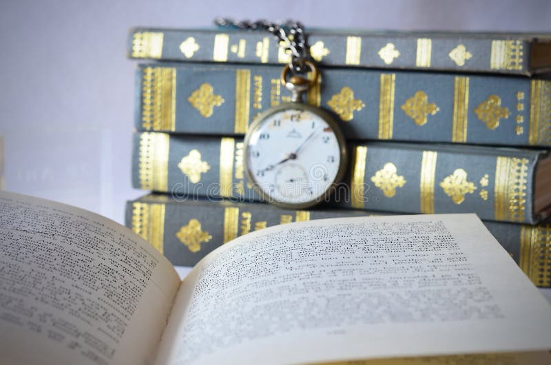 Books with old watch stock photo. Image of book, watch - 49917258