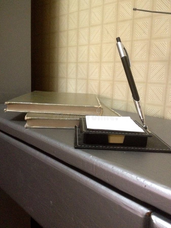 Books, Silver Plated Pen and Pen Holder and Note Paper on Desk. Stock ...