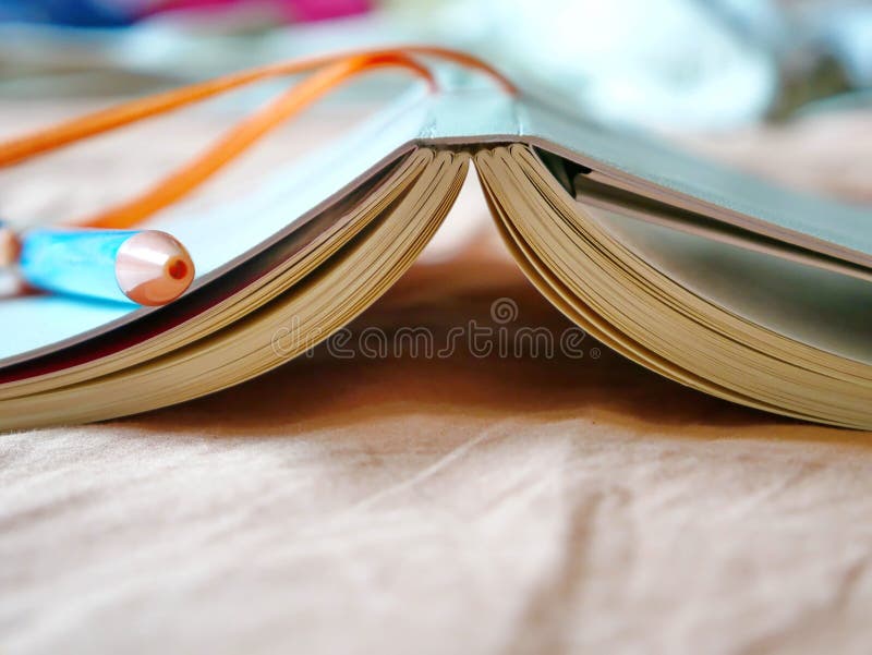 Books and Pens are Placed on the Bed. Stock Image - Image of book ...