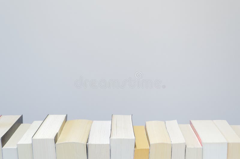 Books in a Row on Light Grey Background Stock Photo - Image of ...