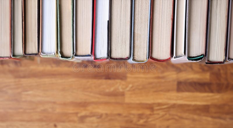 Books are in Row on Wooden Table Closeup Stock Photo - Image of store ...