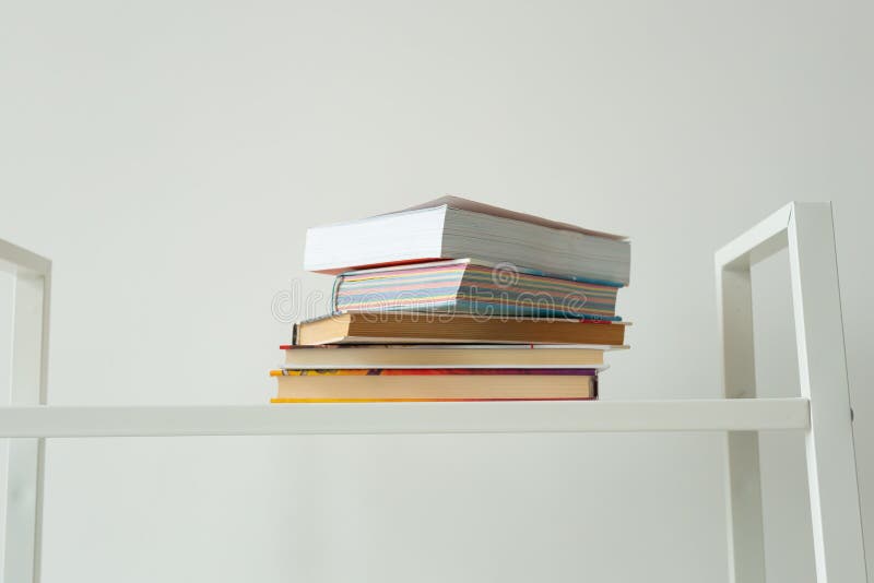 Books Standing on a White Rack at Home. Knowledge, Study and Literature ...