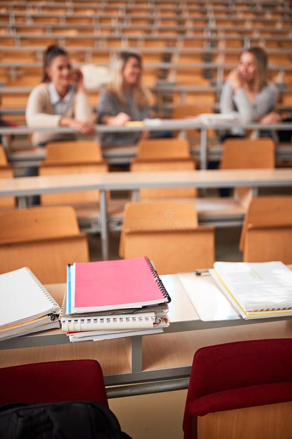 Books on Table in an Amphitheater Lecture Hall Stock Image - Image of ...