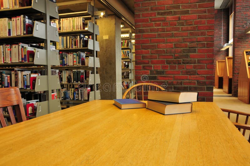 Books on a Table in a Library Stock Image - Image of modern, study: 4885353