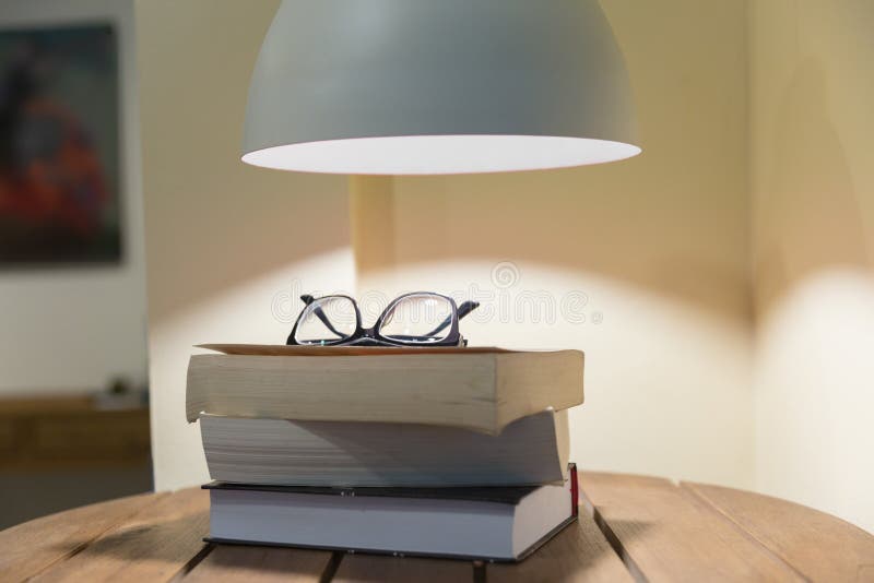 Books Under Lamp stock image. Image of cover, lampshade - 19204367