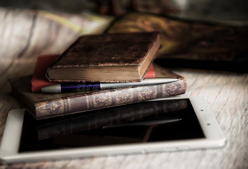 Books and Tablet Computer on a Table Stock Photo - Image of close ...